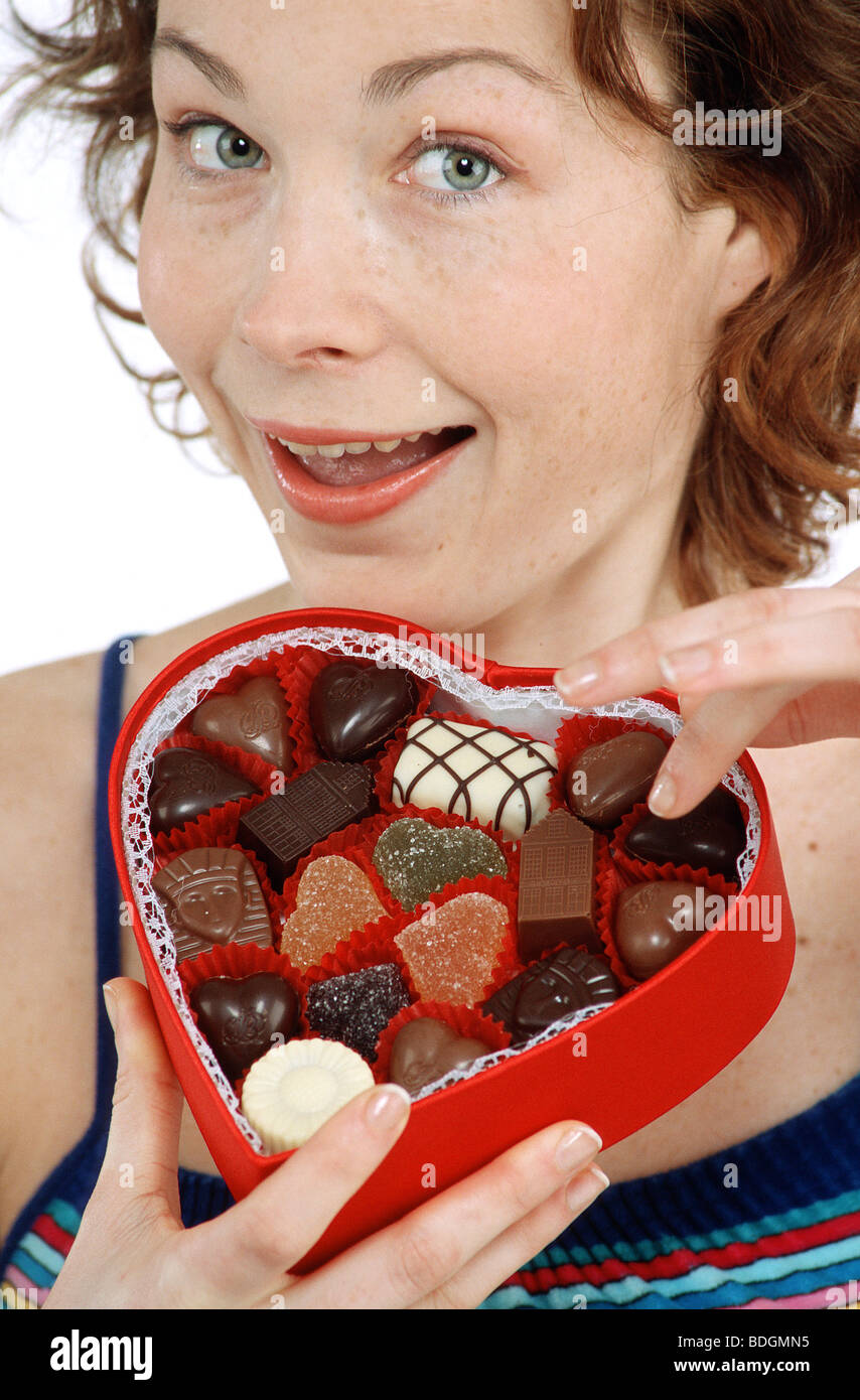 WOMAN EATING SWEETS Stock Photo - Alamy