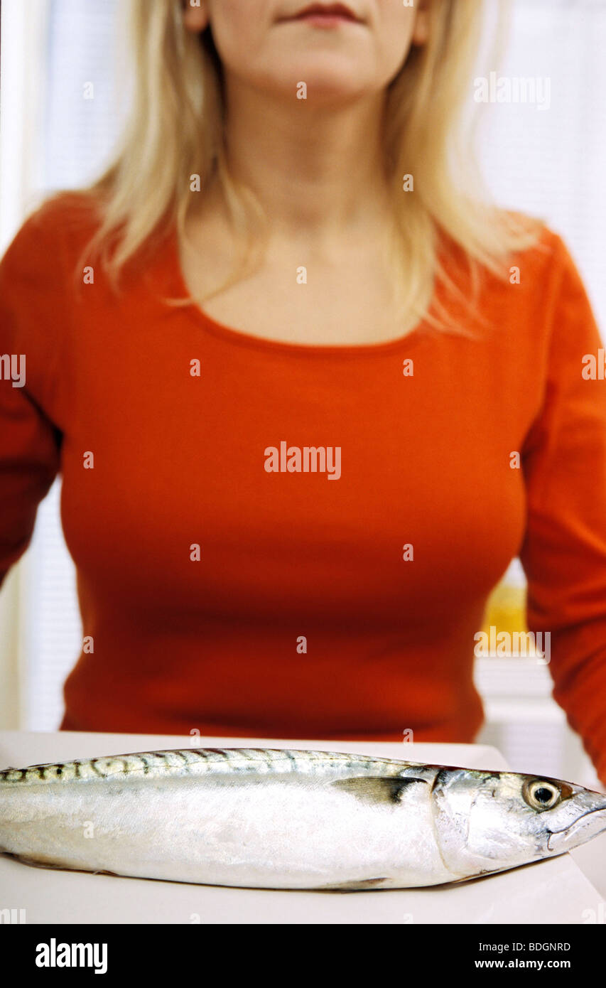 Oily fish woman eating hi-res stock photography and images - Alamy