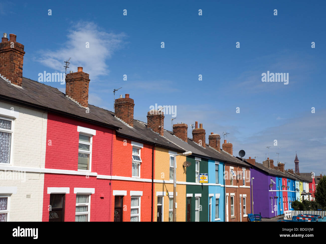 Colourful houses with Blackpool tower in distance Stock Photo - Alamy