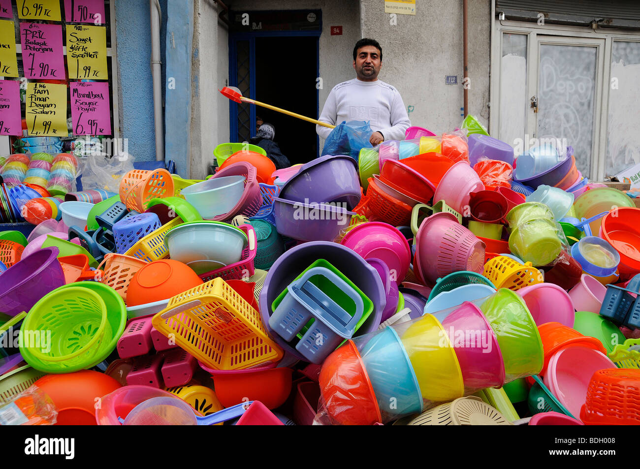 Man selling plastic colorful bowls on a market in Istanbul Stock Photo ...