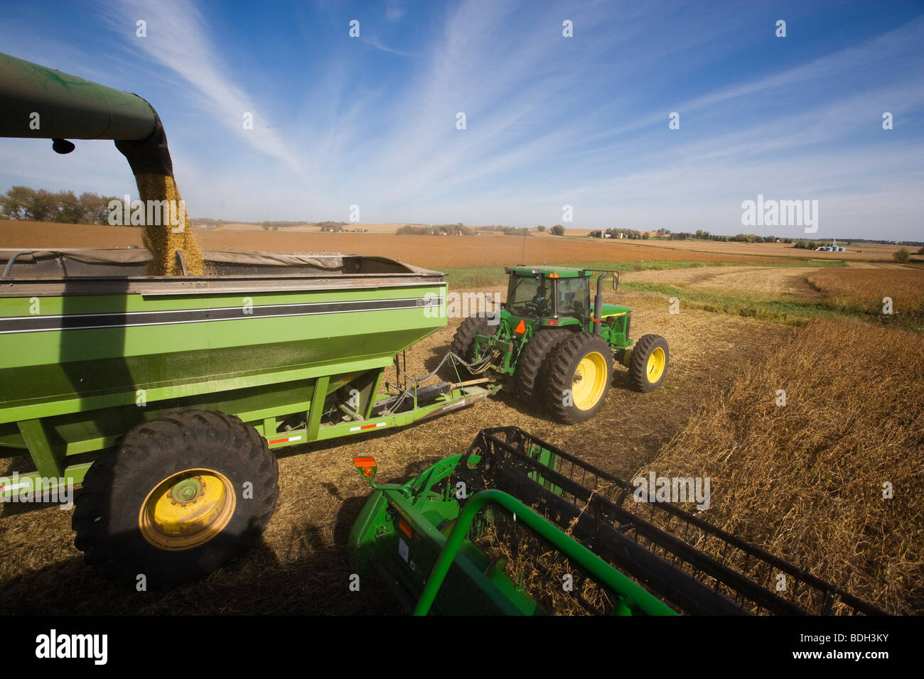 View from the deck of a John Deere combine harvesting soybeans in ...