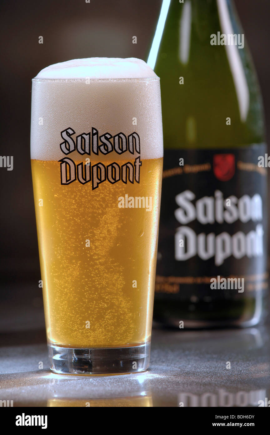 Glass and bottle of Saison Dupont Belgian beer Stock Photo - Alamy