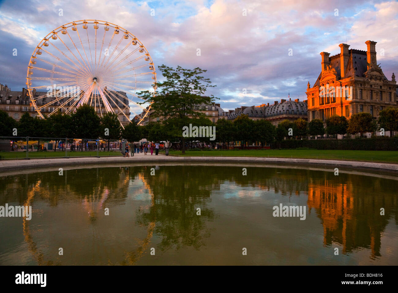 Famous tourist attraction Louvre pavilion carousel Tuileries reflected ...