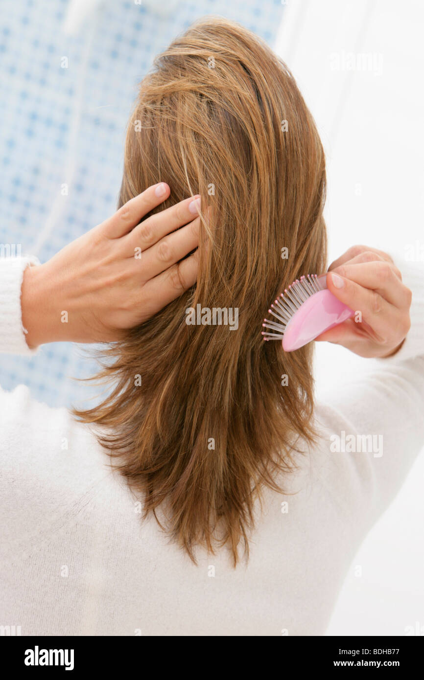 Brushing someones hair hi-res stock photography and images - Alamy