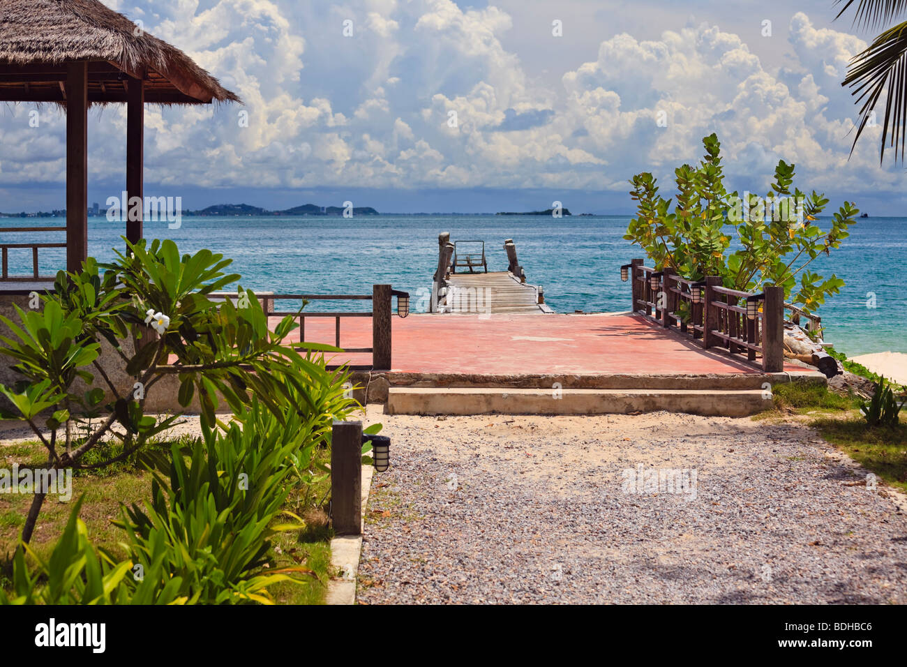 Hut and jetty on a beach in thailand Stock Photo - Alamy