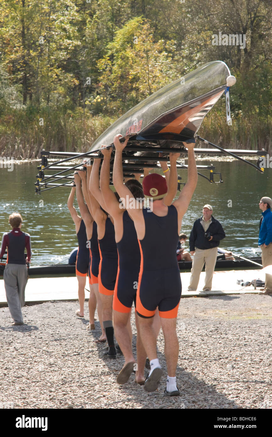 Members of the men's crew team at Hobart College carry their 8 man ...