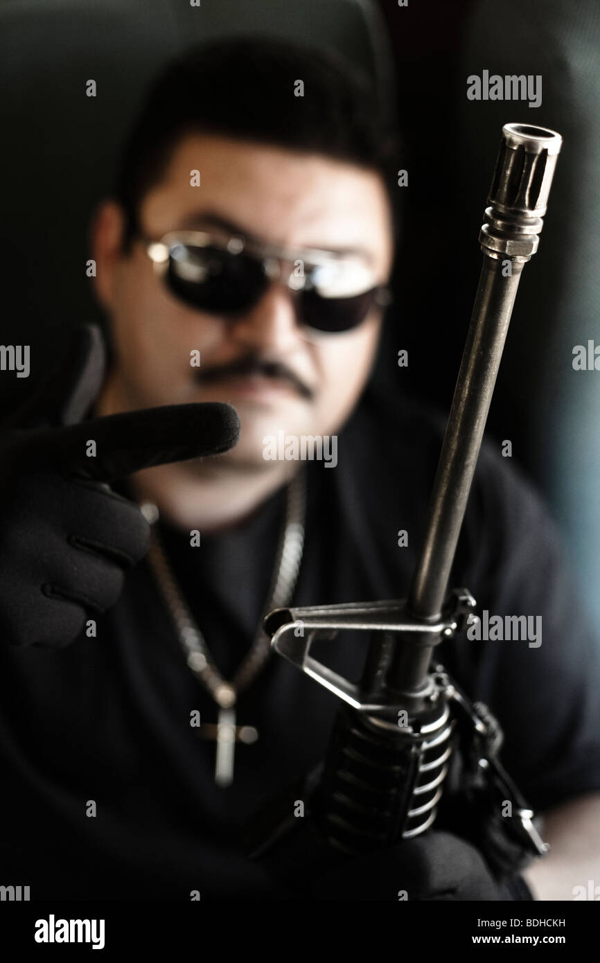 Policeman with gun hi-res stock photography and images - Alamy