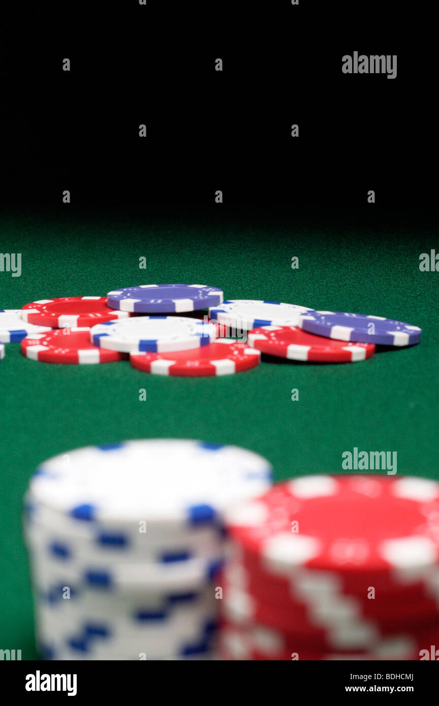 Poker chips at table Stock Photo - Alamy