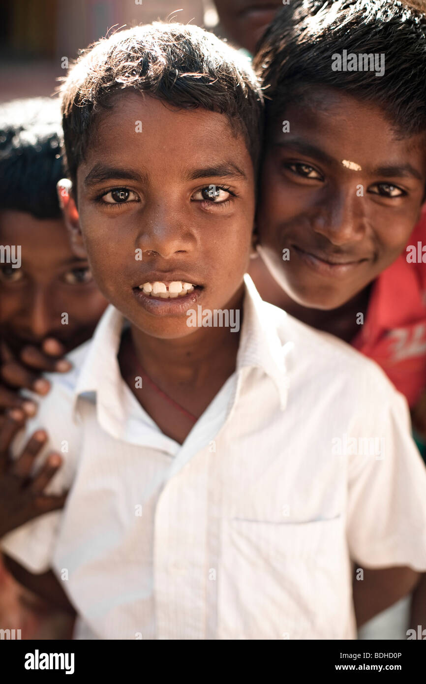Three young boys smile for a portrait Stock Photo - Alamy