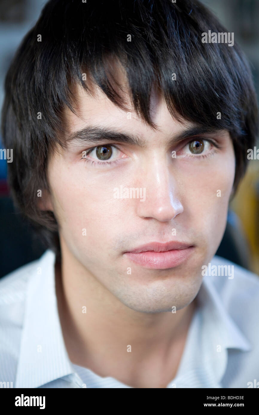 close up portrait of young serious handsome man Stock Photo - Alamy
