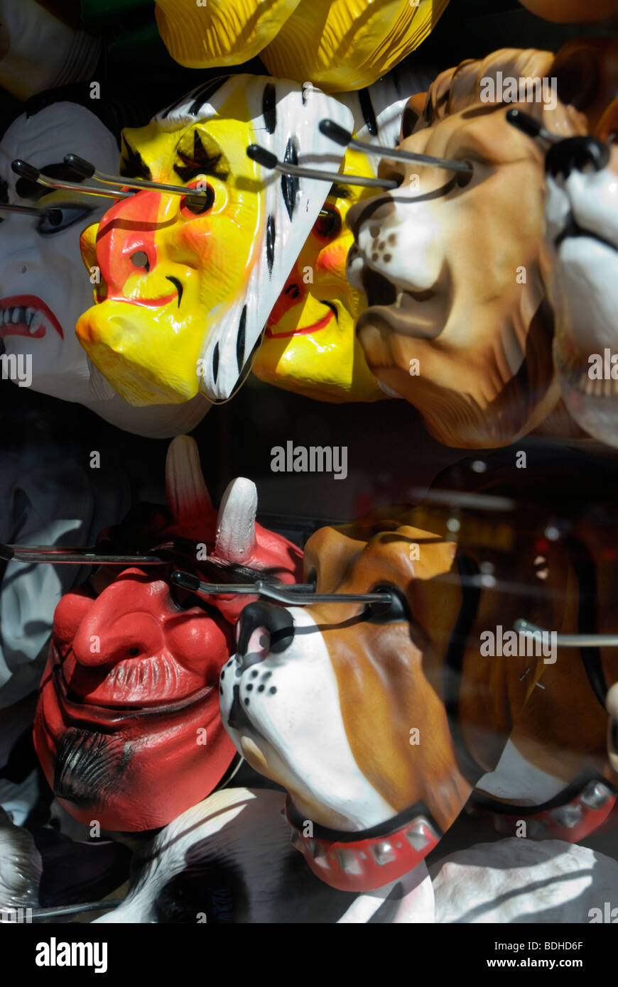 Colourful humorous masks in joke shop window Stock Photo - Alamy