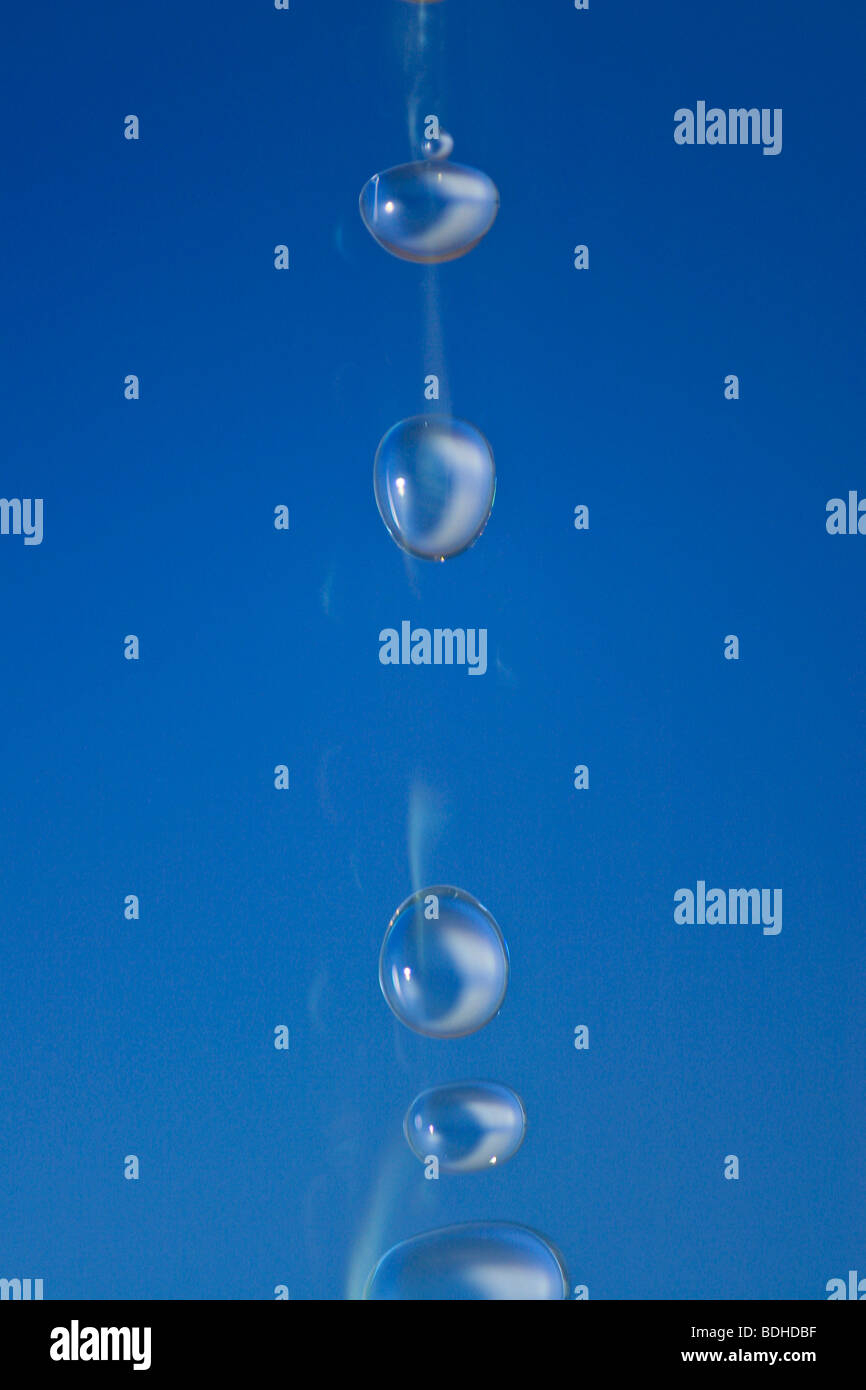 Water drops falling from tap Stock Photo - Alamy
