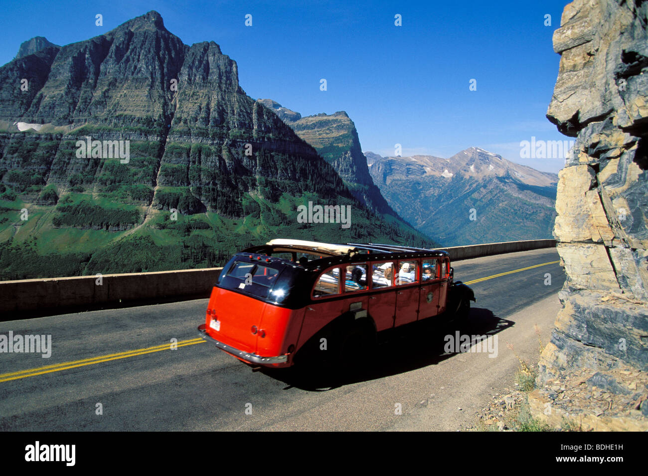 An historic red bus, Glacier National Park, MT Stock Photo - Alamy