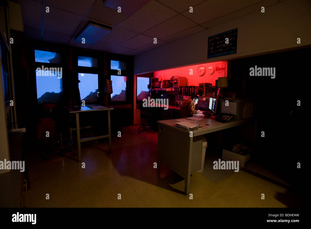 A staff Weather Observer, checks the temperature and other ...