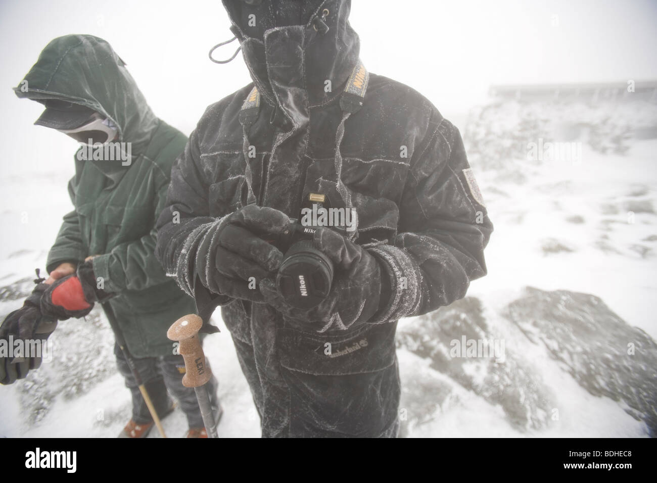 A group of people experiences the severe elements of wind and ...