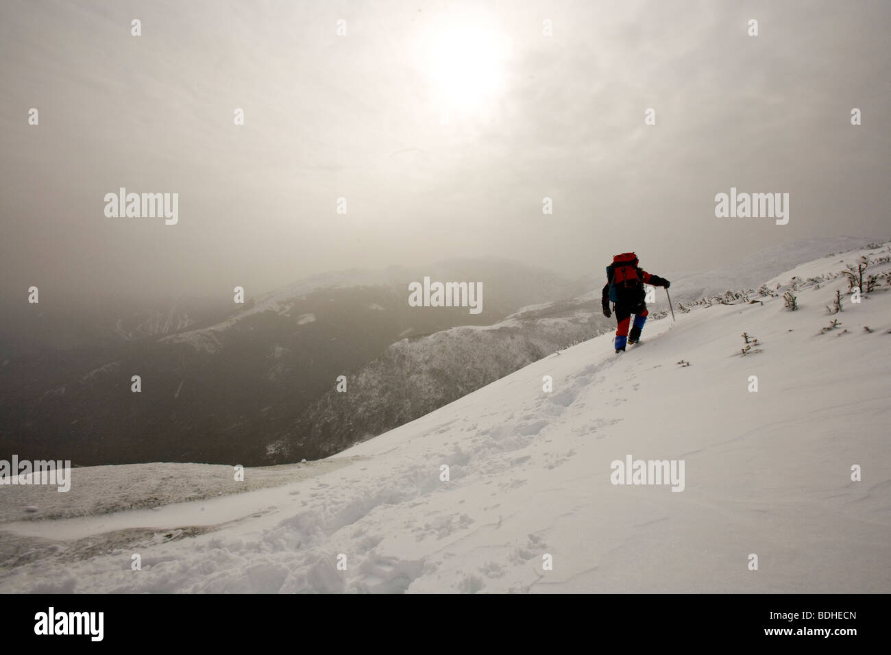 A man hiking on the north end of the Presidential Range and the ...