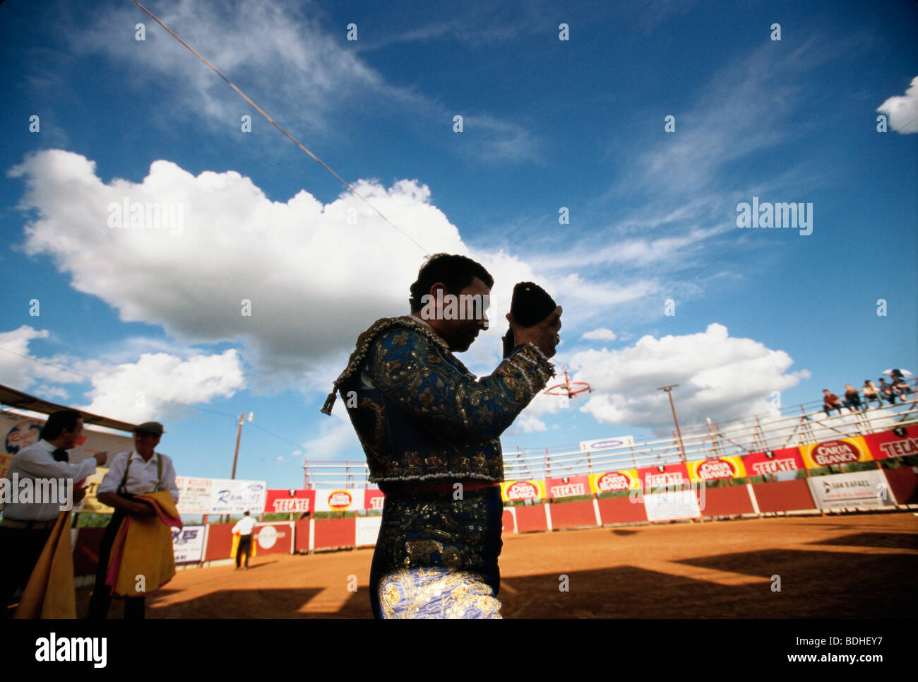 A matador puts on his cap or Montera Stock Photo - Alamy