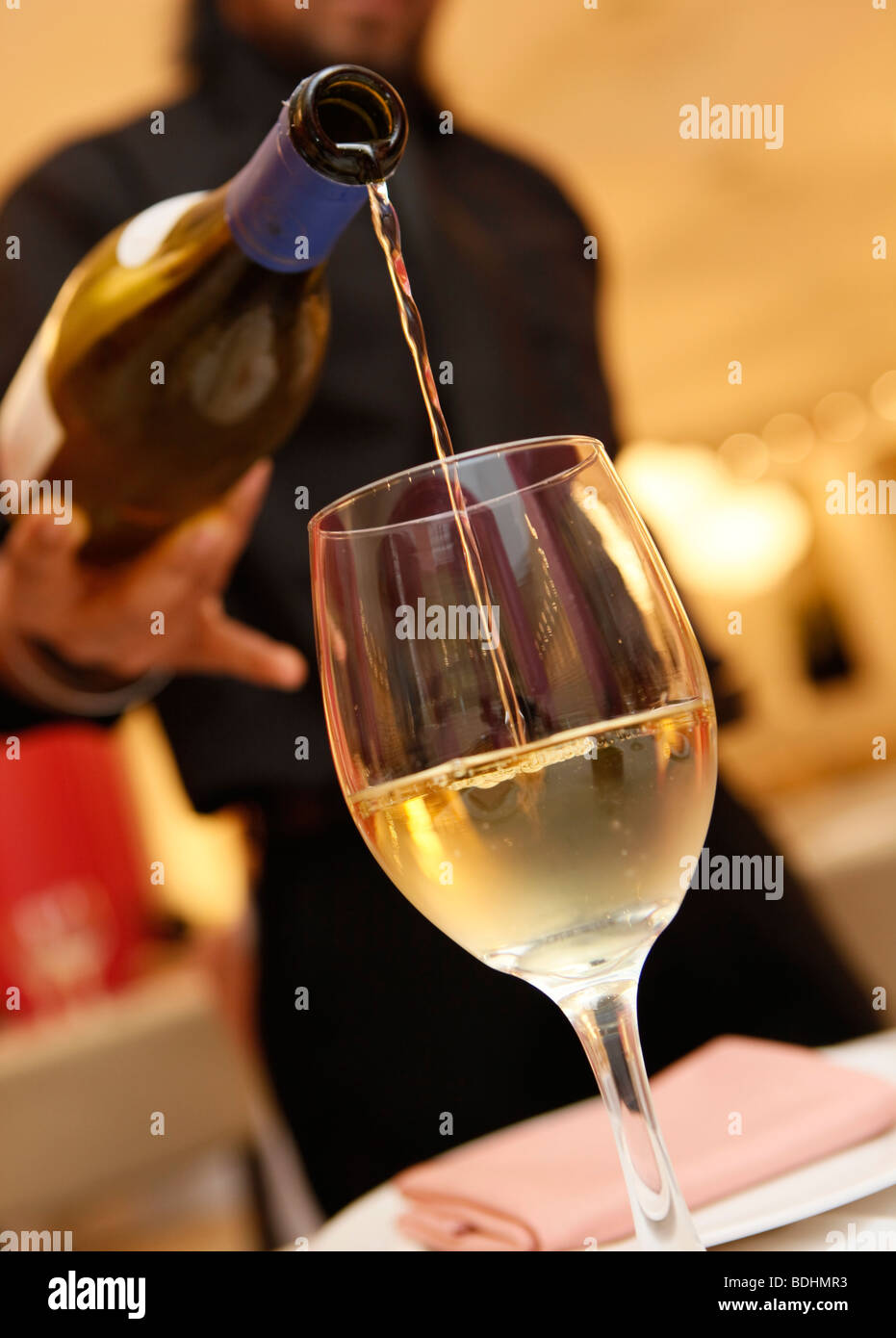 white wine being poured in Shimla Pinks nightclub Stock Photo - Alamy