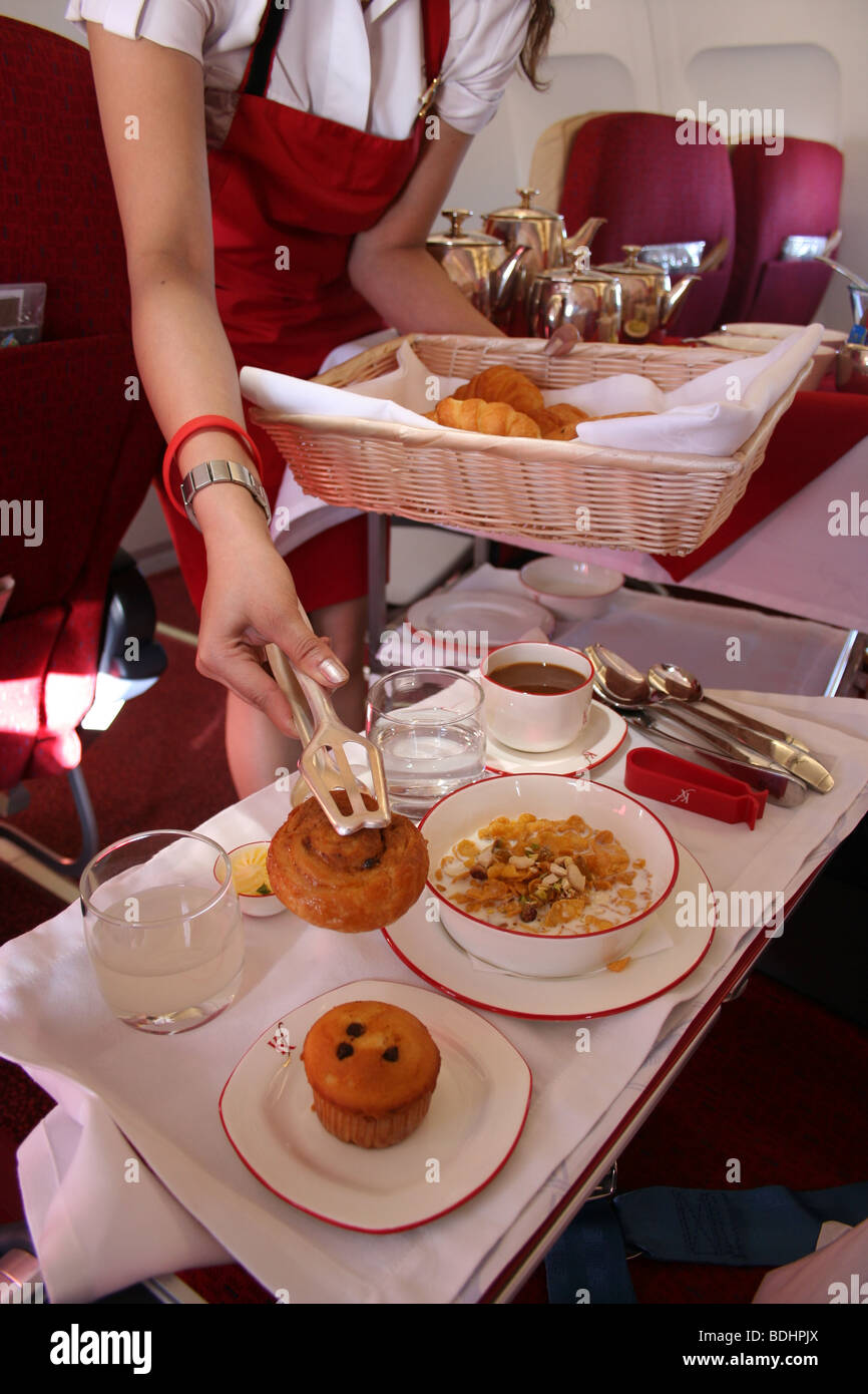 First Class Plane Meal Stewardess preparation Stock Photo - Alamy
