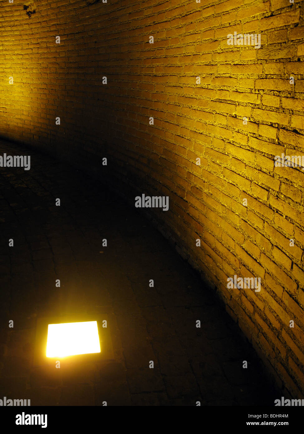 one bright security light in dark alley at night Stock Photo - Alamy