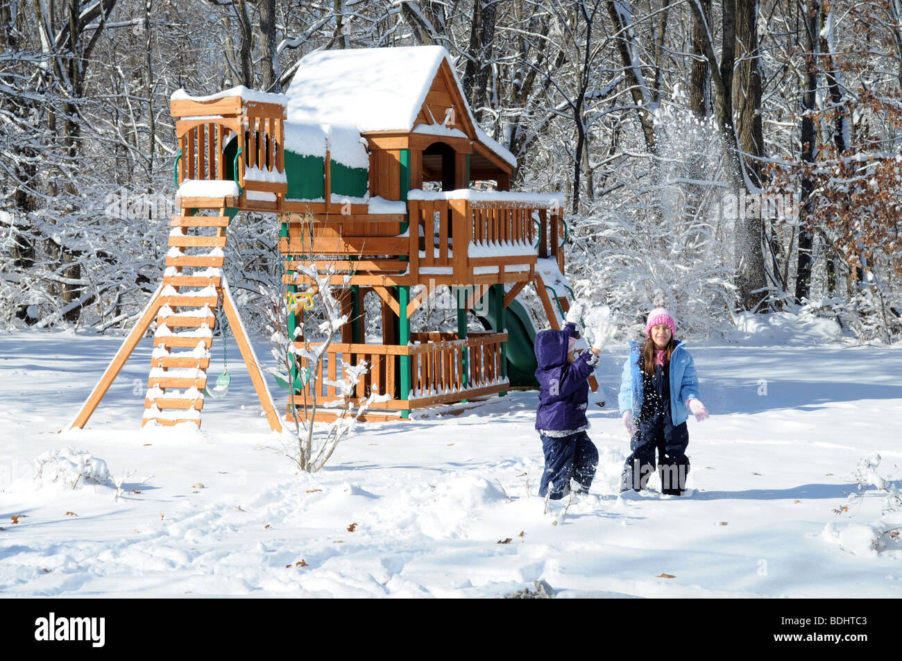 Children snowing playing hi-res stock photography and images - Alamy