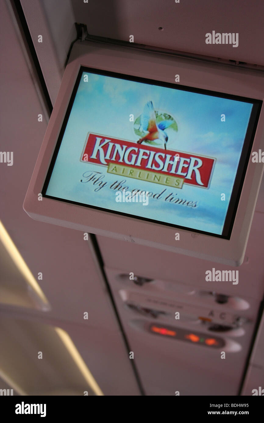 Overhead video monitor in flight kingfisher airlines Stock Photo - Alamy