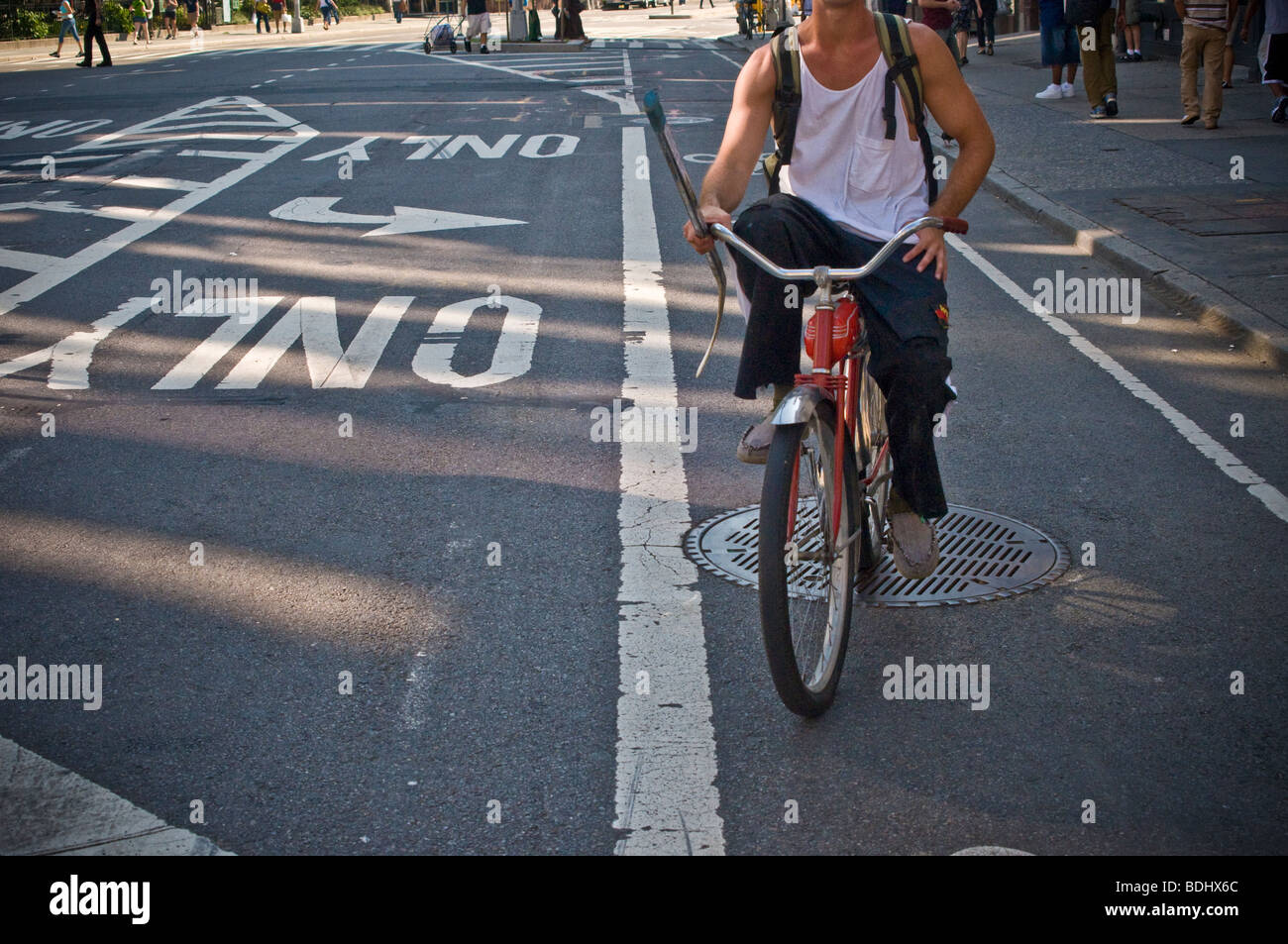 One man rides in NYC bike lane Stock Photo - Alamy