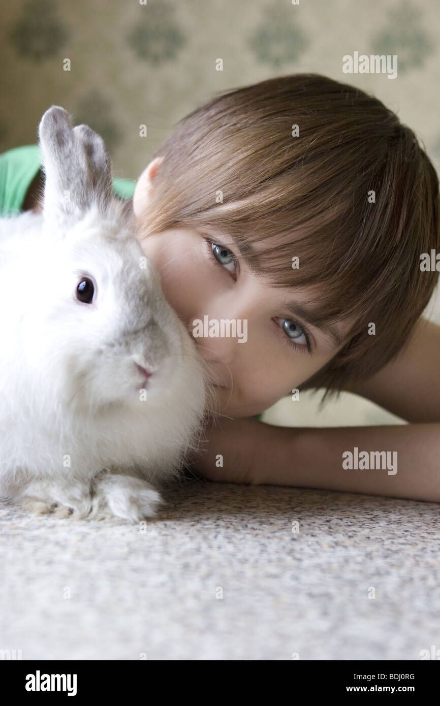 Young smiling adorable woman with rabbit Stock Photo - Alamy