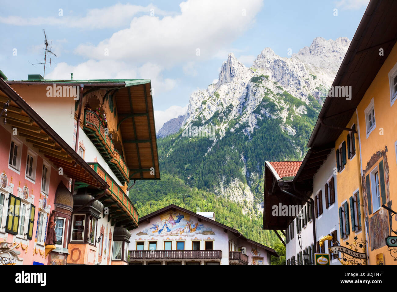 Germany, Bavaria - Decorated shop fronts and houses in Mittenwald, with ...