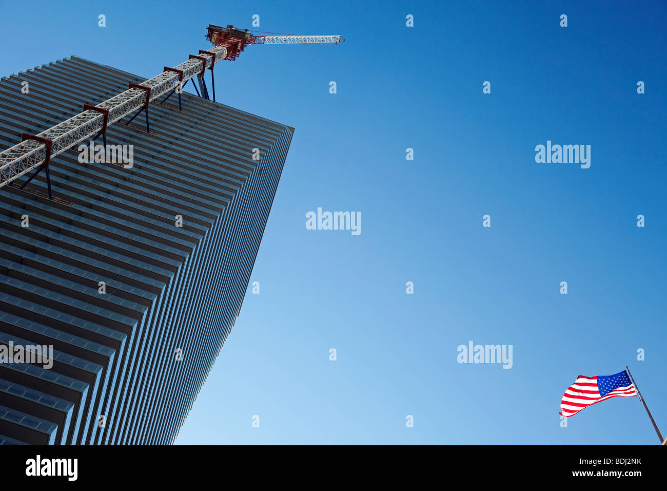 building under construction with an american flag Stock Photo - Alamy