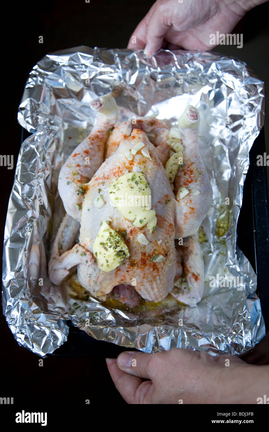 Raw chicken, prepared and seasoned before going in oven Stock Photo - Alamy