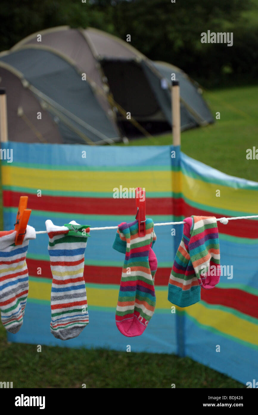 Socks hanging on a washing line at a campsite Stock Photo - Alamy
