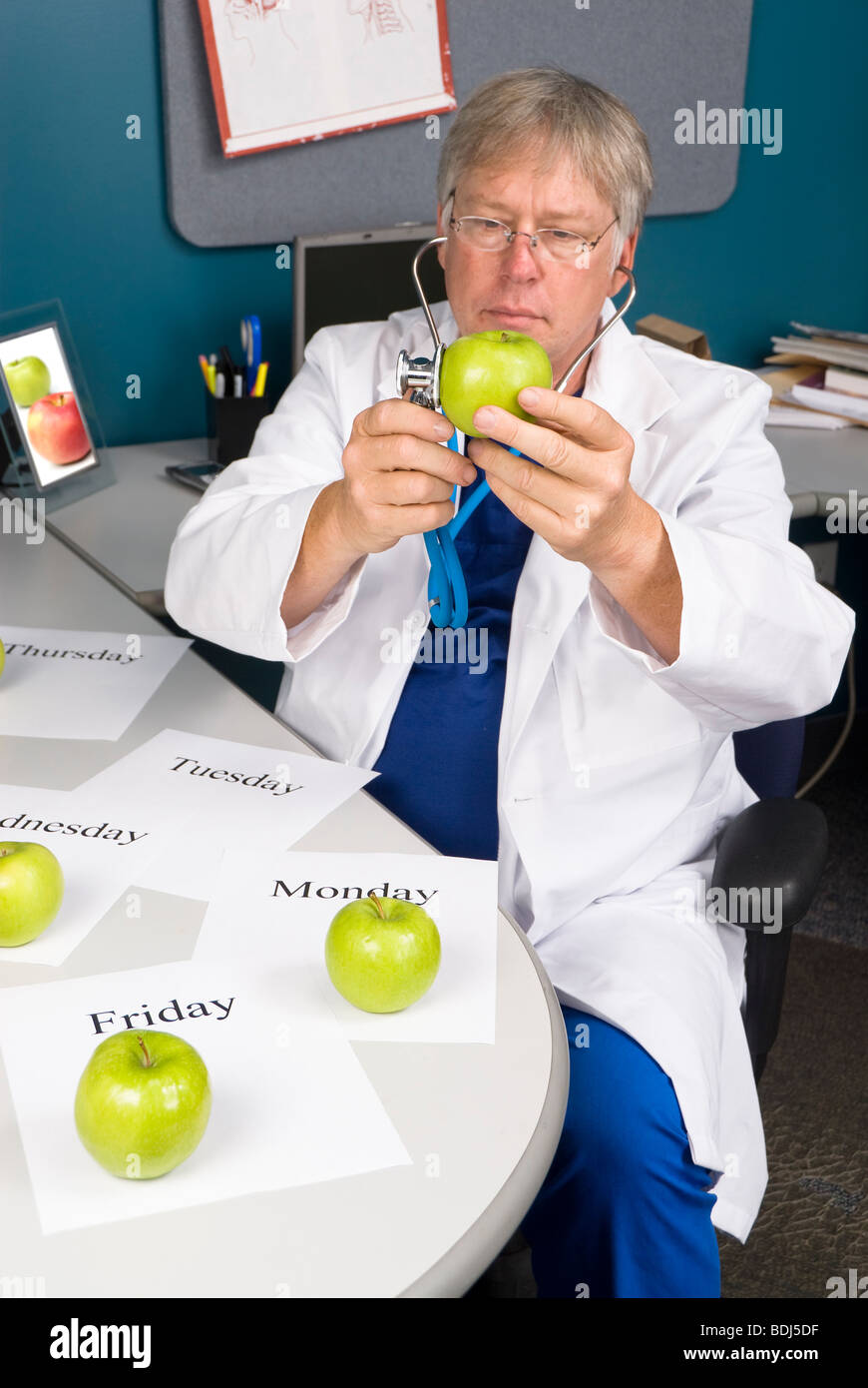 A doctor examines an apple with his stethoscope. Image is useful for ...