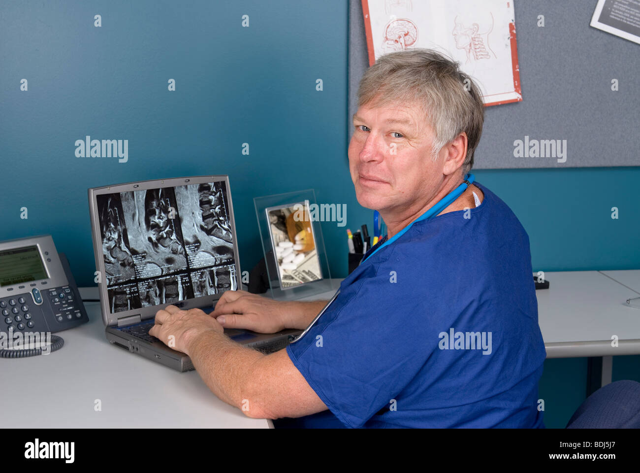Doctor diagnosing mri on computer hi-res stock photography and images ...