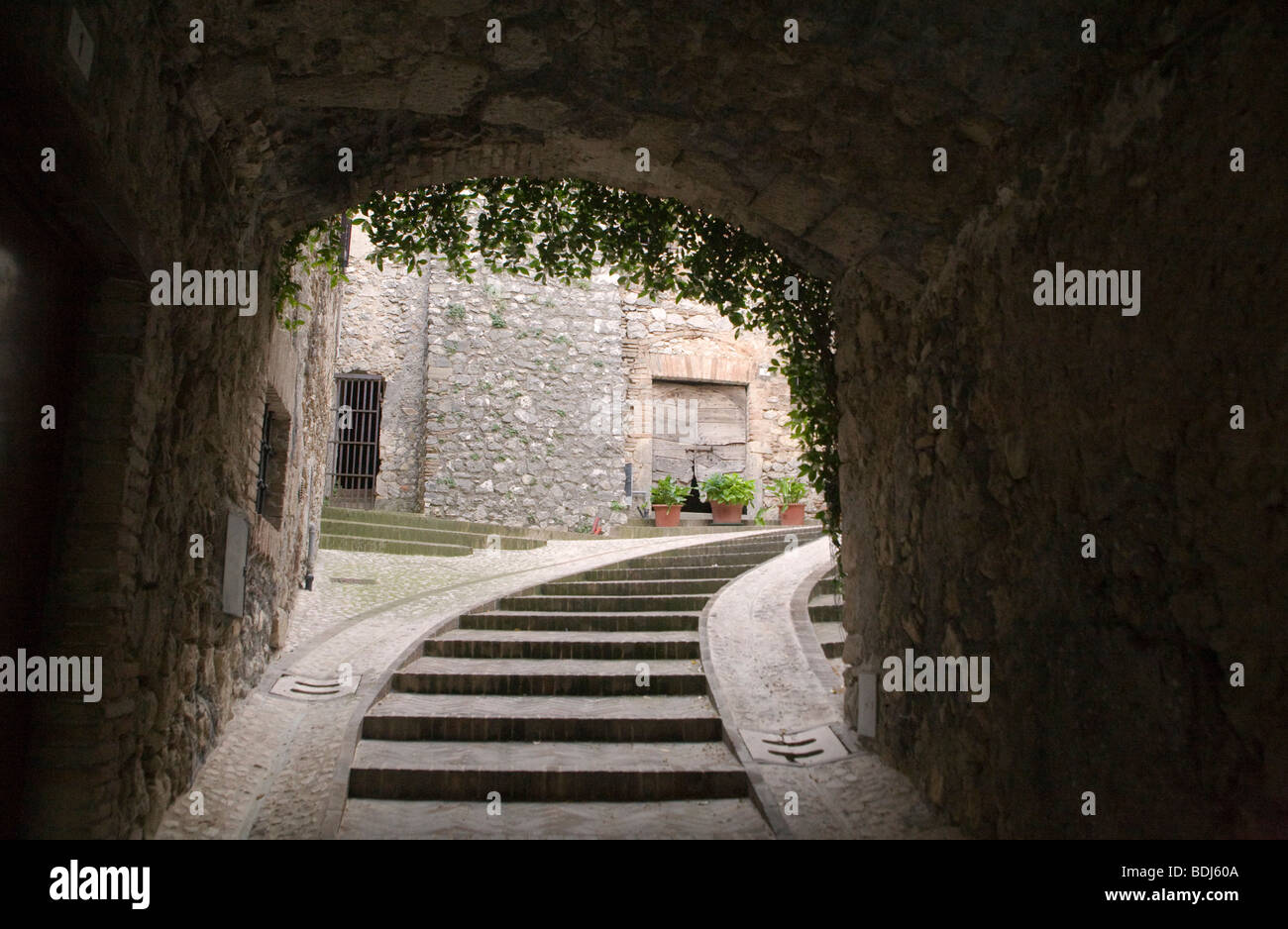 Arched passage and steps in the old town of Alviano, Umbria, Italy ...