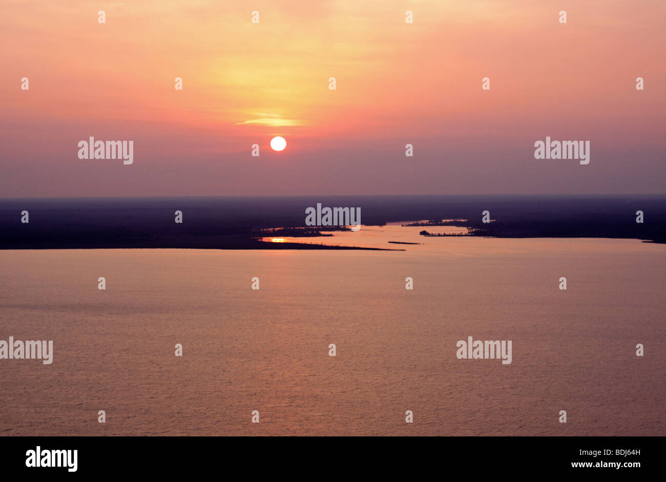 Light reflecting on water at sunset Stock Photo - Alamy