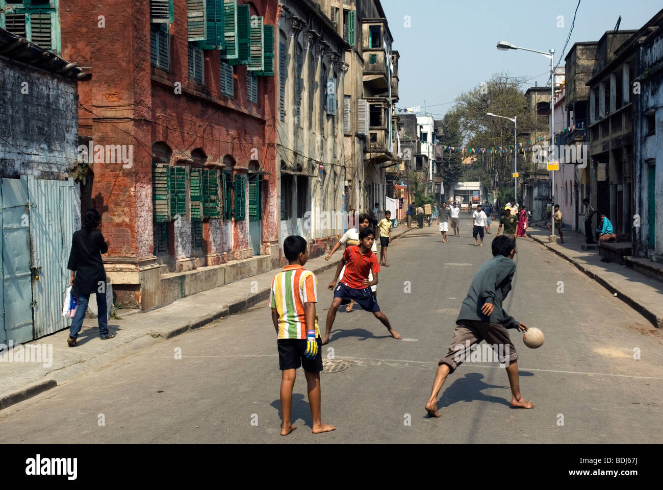 Boys Playing Football In The Street Stock Photos & Boys Playing ...