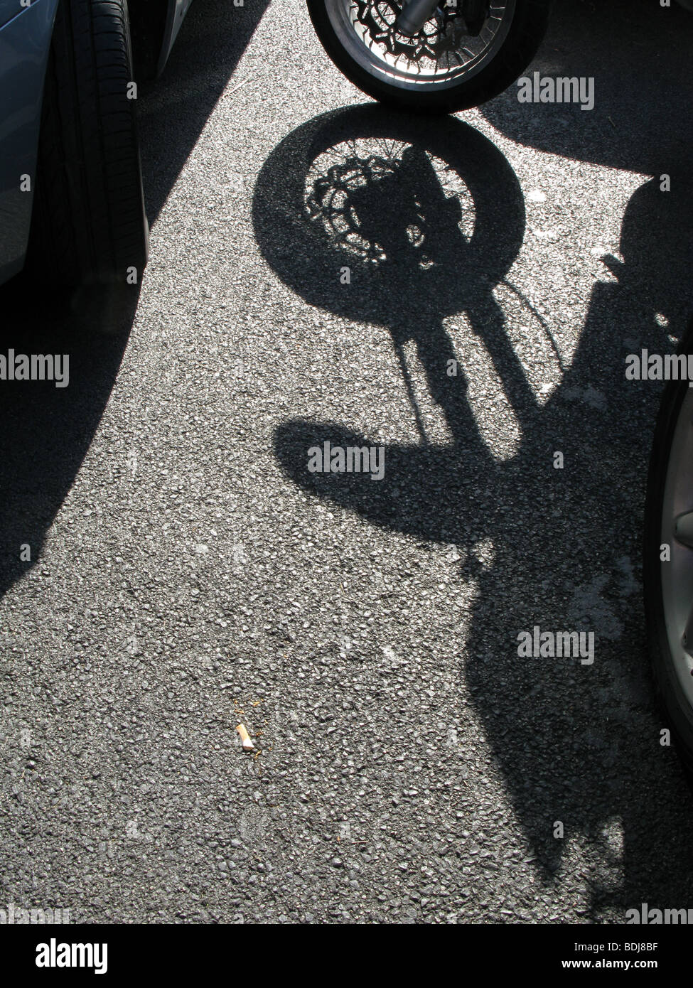 one motorbike shadow on floor street road Stock Photo - Alamy