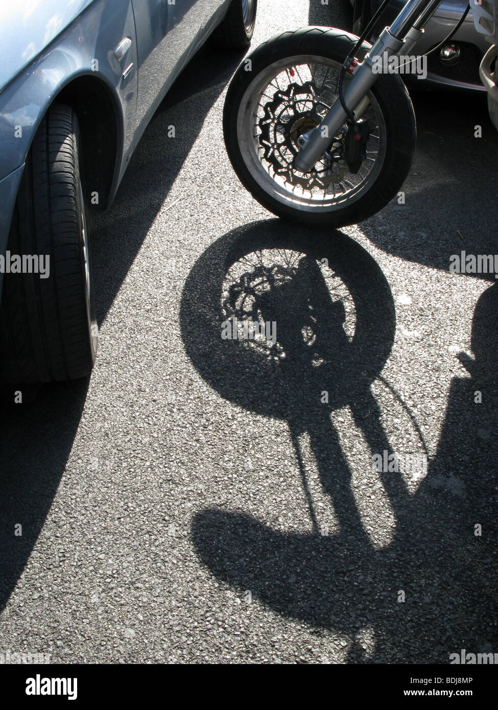 one motorbike shadow on floor street road Stock Photo - Alamy