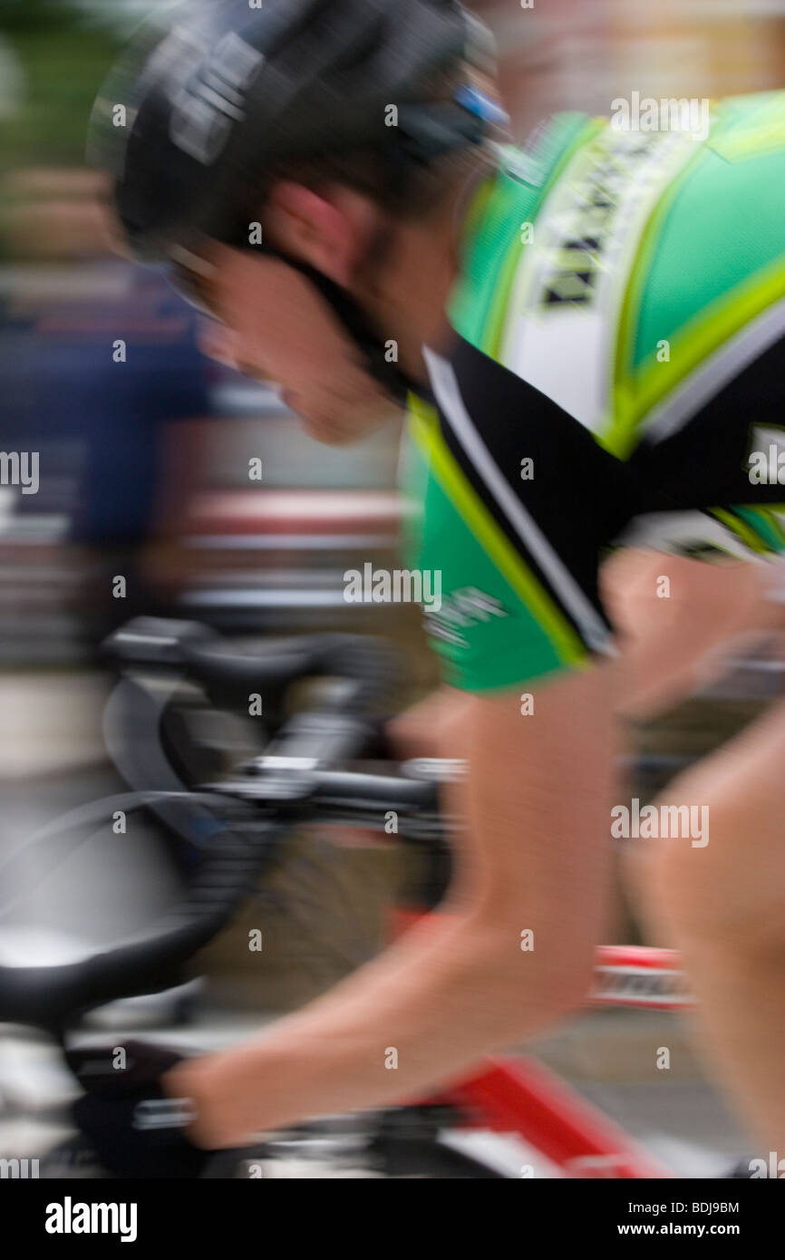 Biker races through city streets Stock Photo - Alamy