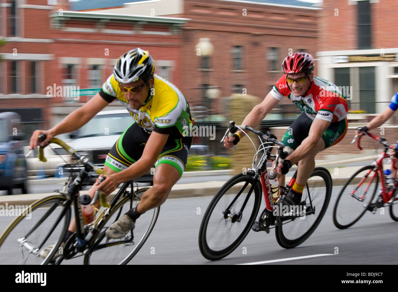 Bikers race through city streets Stock Photo - Alamy