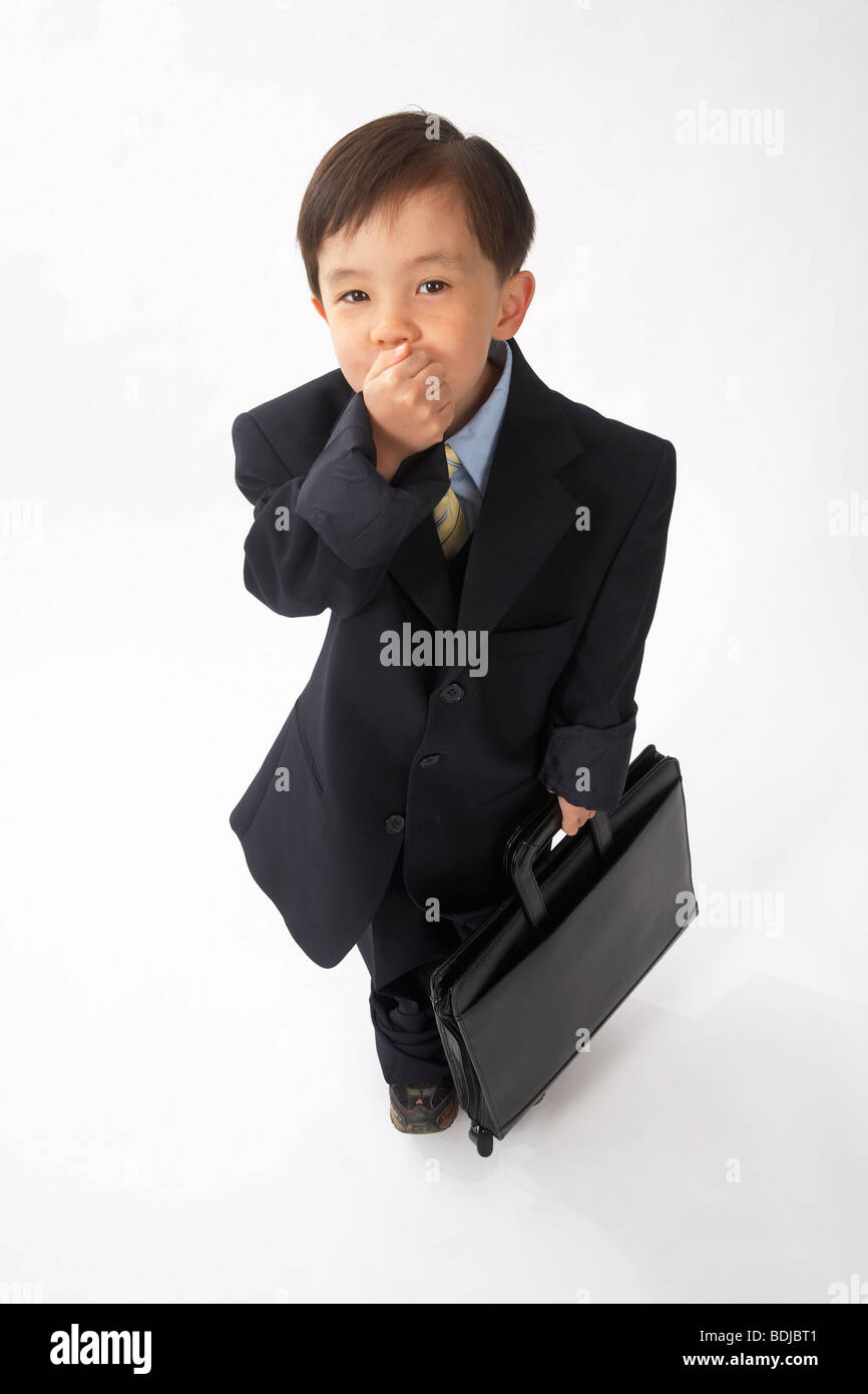 Little Boy Dressed Up as a Businessman Stock Photo - Alamy