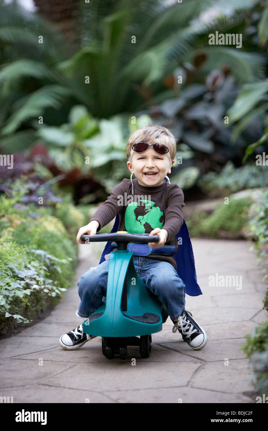 Boy on Riding Toy Stock Photo - Alamy