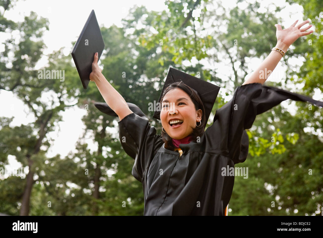 Woman cheering diploma in hi-res stock photography and images - Alamy
