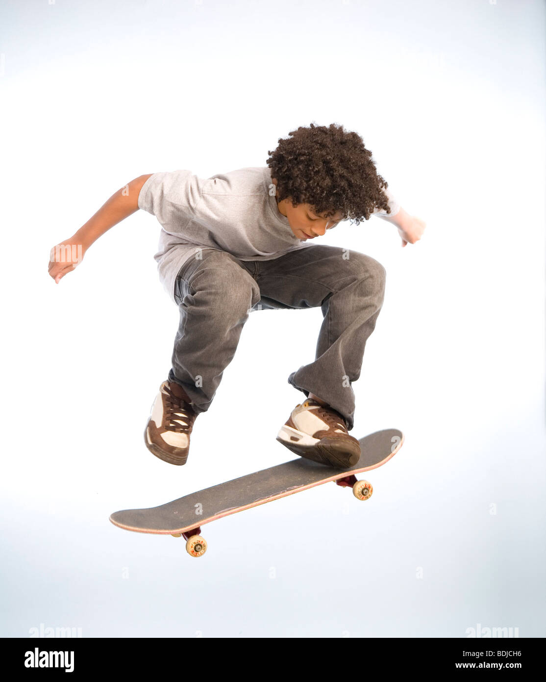 Skateboarder Doing an Ollie Stock Photo - Alamy