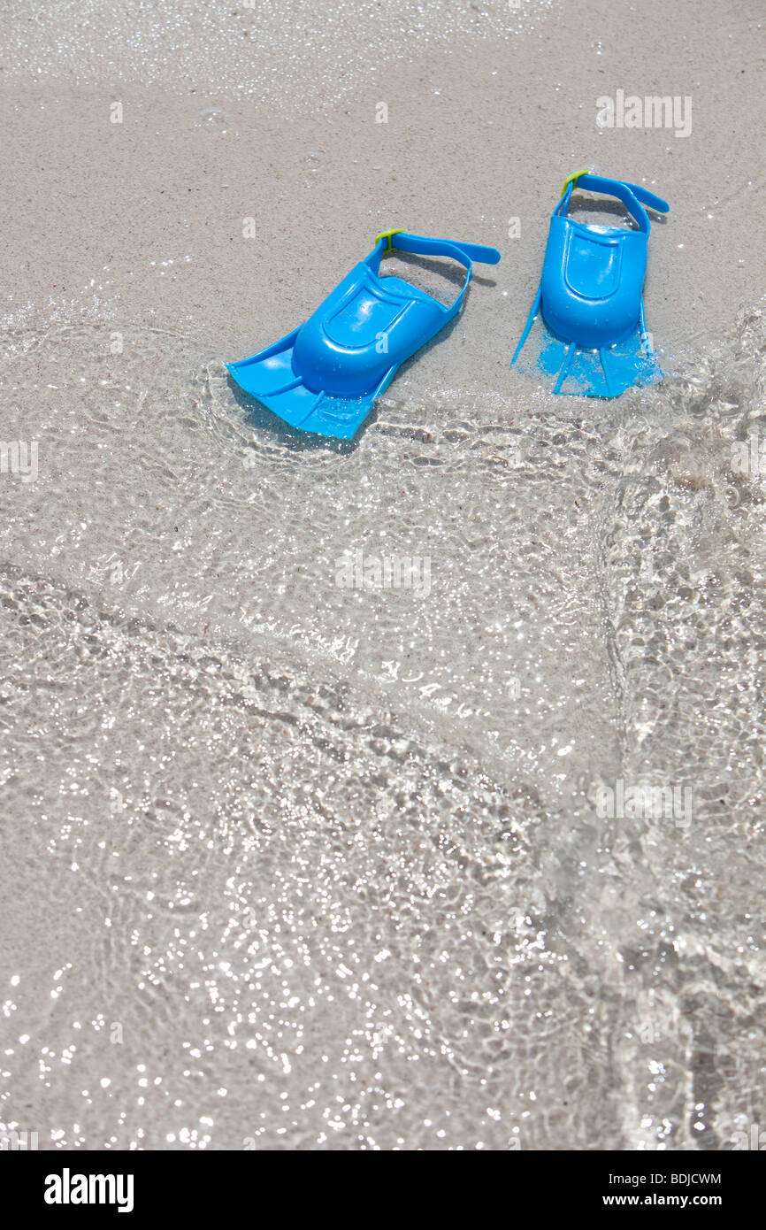 Blue Flippers in The Surf Stock Photo - Alamy