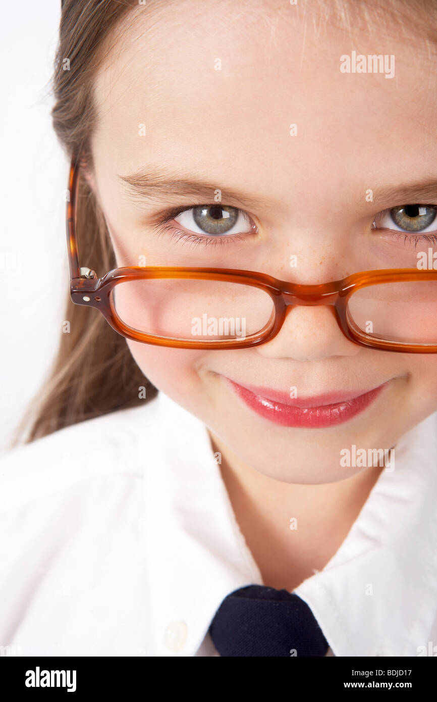 Girl Looking over Glasses Stock Photo - Alamy