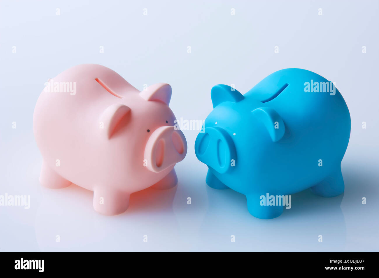 Comparing two piggy banks hi-res stock photography and images - Alamy