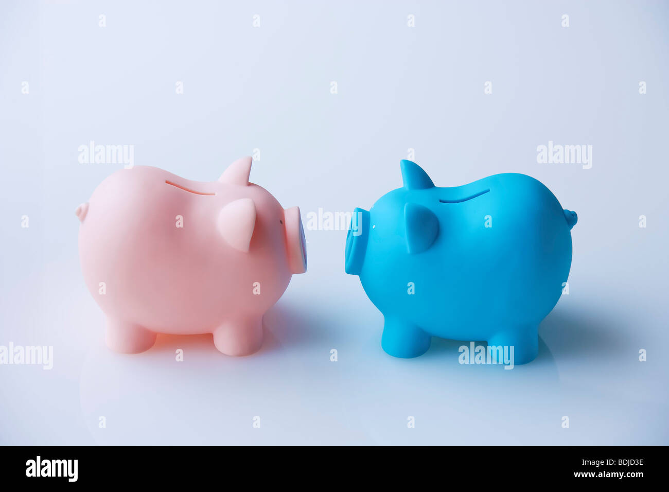 Comparing two piggy banks hi-res stock photography and images - Alamy