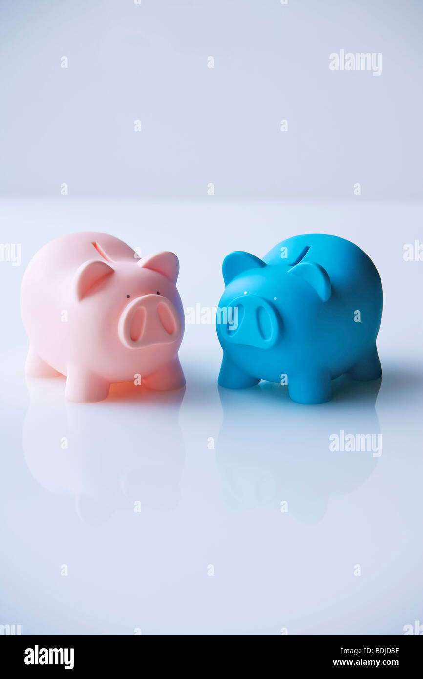 Comparing two piggy banks hi-res stock photography and images - Alamy